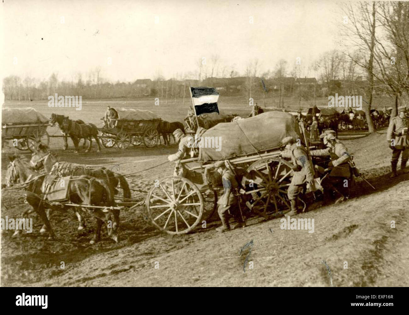 This painting captures a scene featuring a cart with a folded balloon ...
