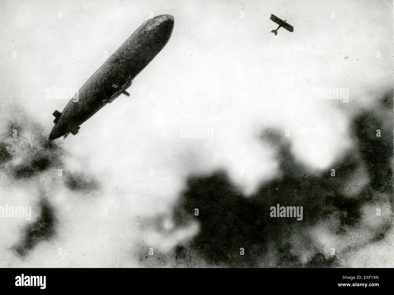 This image portrays a German aircraft attacking a French Zeppelin ...