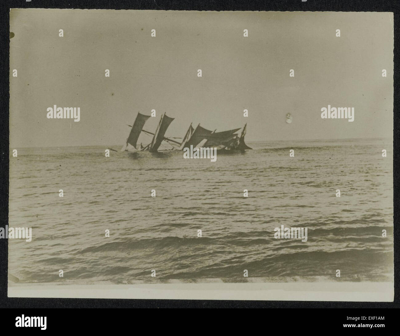 This historical image captures the sinking of a torpedoed sailing ship ...