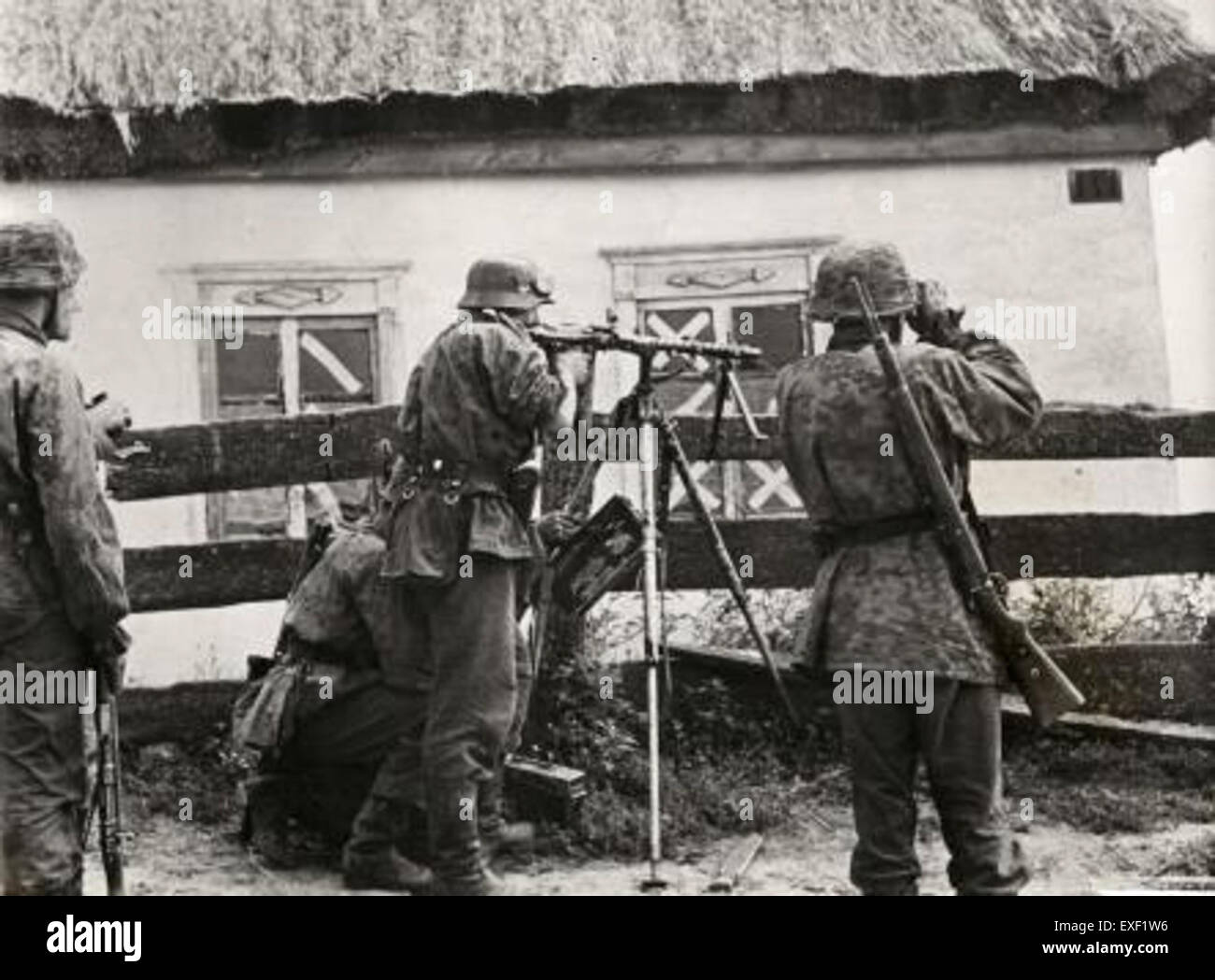 This photograph shows German soldiers near a farm, captured during a ...