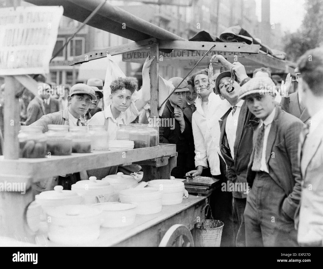 *Haring eten op het Weesperplein* depicts a cultural scene of Dutch ...