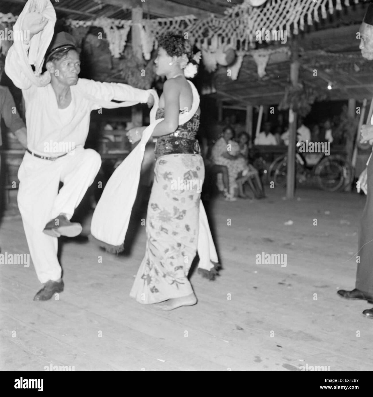 This image features a Javanese dancer at a festive celebration in ...