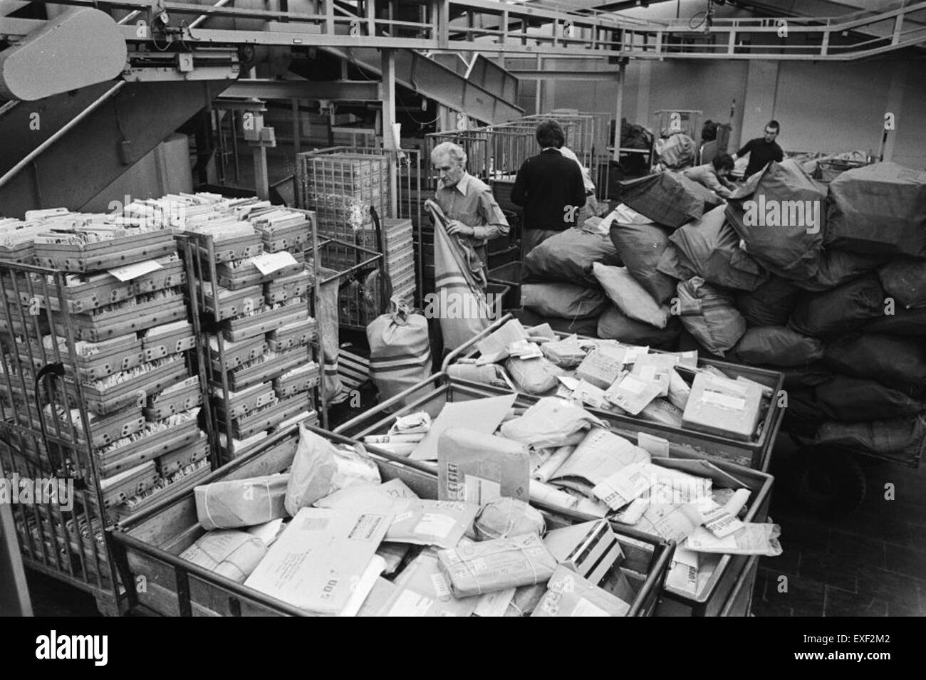 The image shows a busy post office during the Christmas season, with ...
