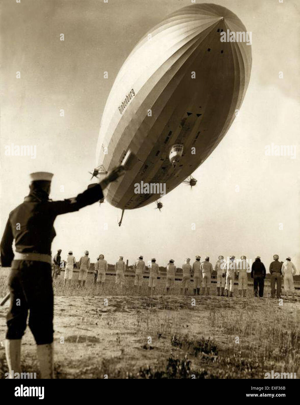 This image shows a mariner greeting a friend aboard a zeppelin. The ...