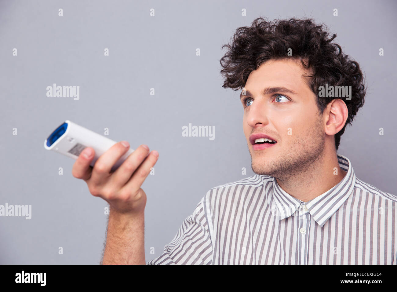 Man holding tv remote hi-res stock photography and images - Alamy