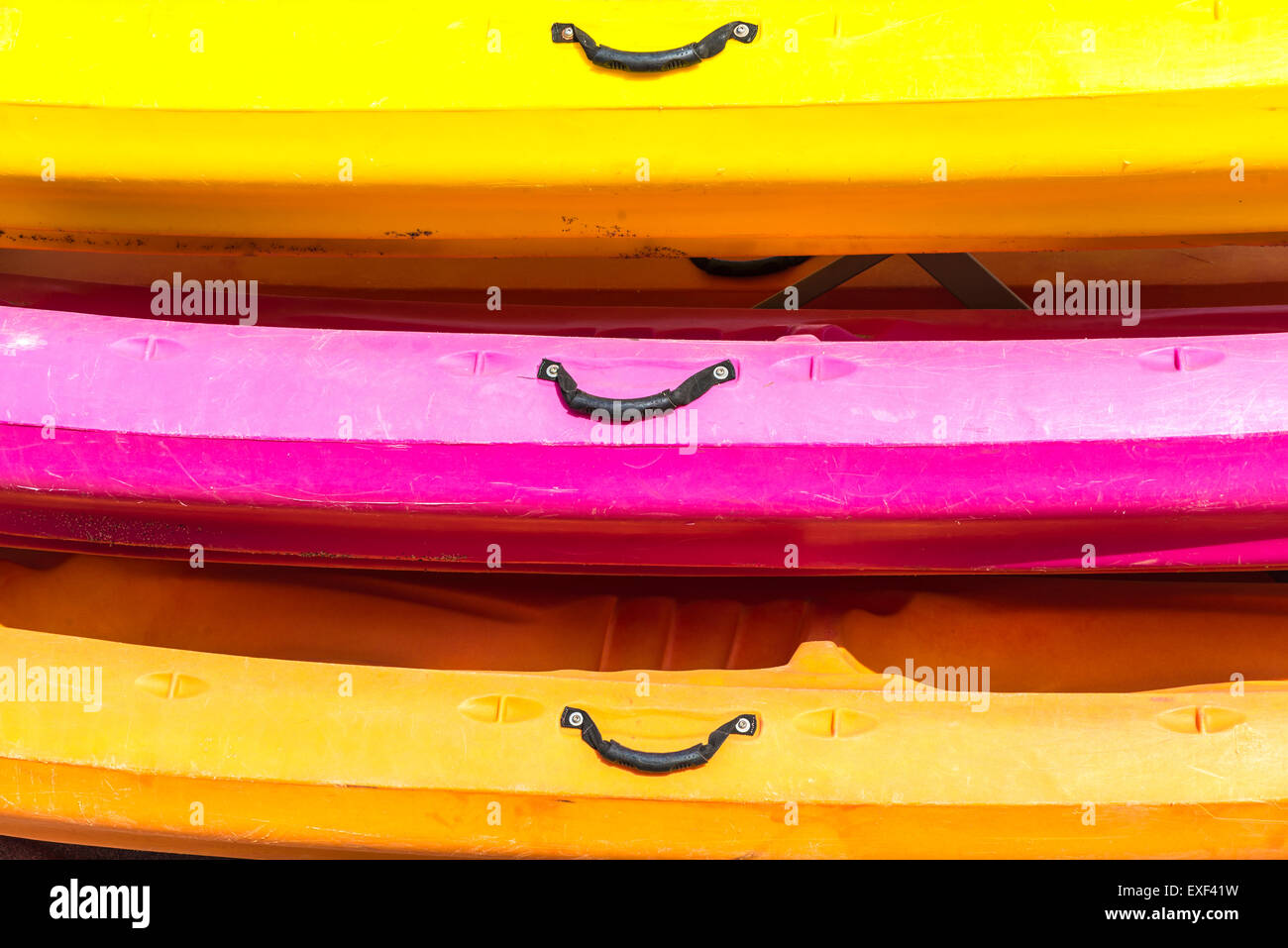 Colorful kayaks in stack Stock Photo - Alamy
