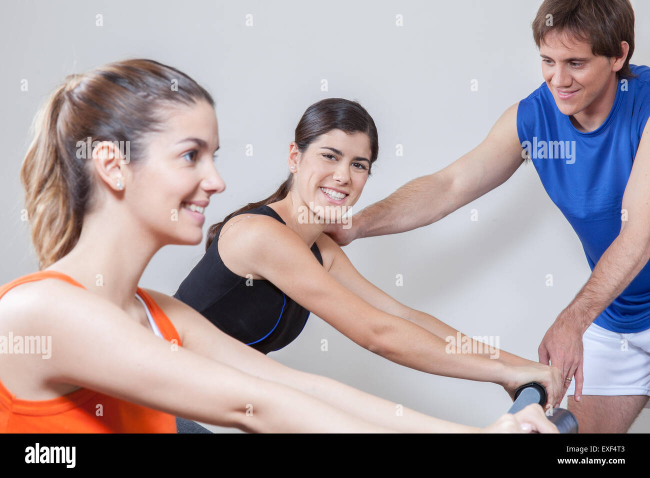 Friends doing exercise Stock Photo - Alamy