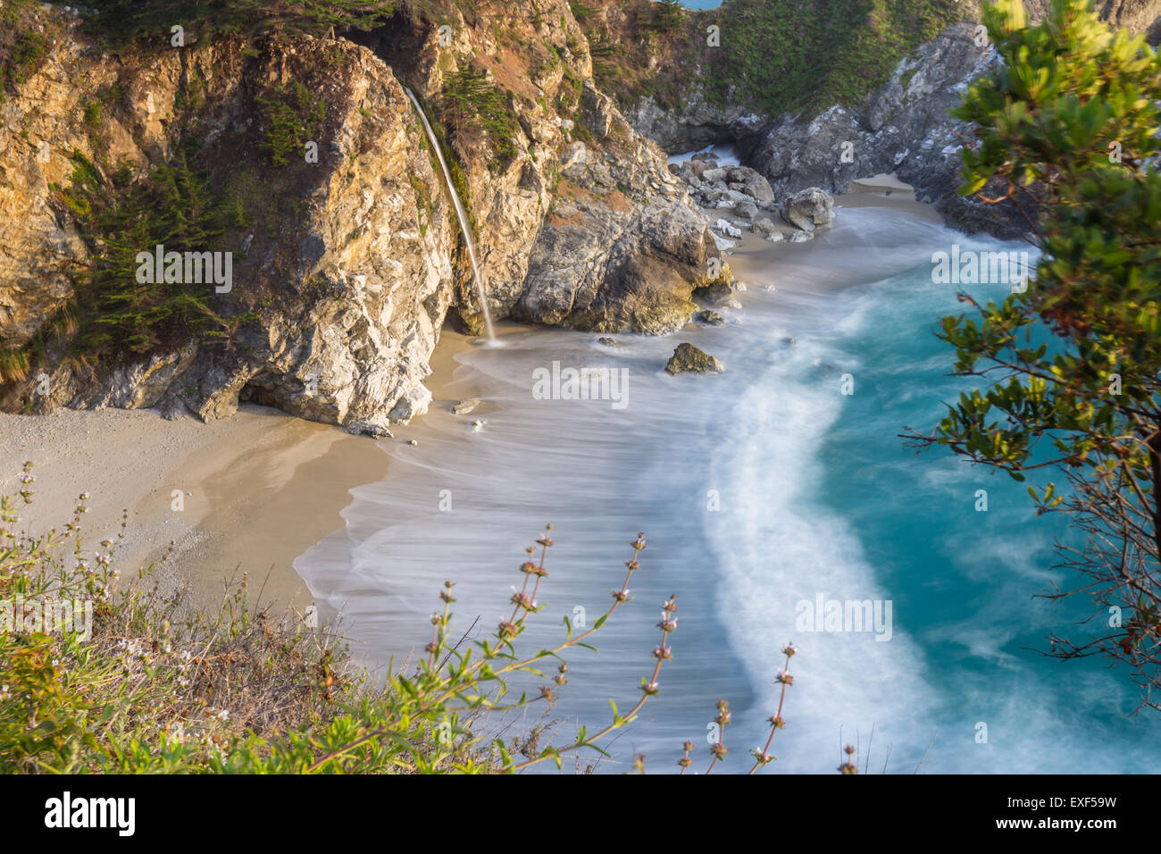 Waterfall in Julia Pfeifer Burns State Park at sunset with a soft ...