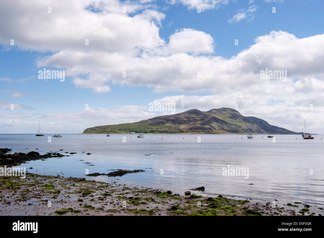 View across calm sea to Holy Island offshore from Lamlash, Isle of ...