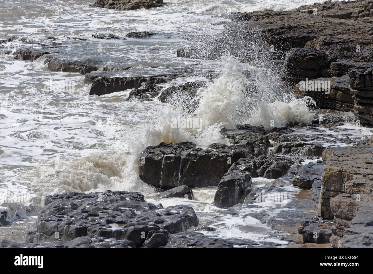 Wave on rocks Stock Photo - Alamy