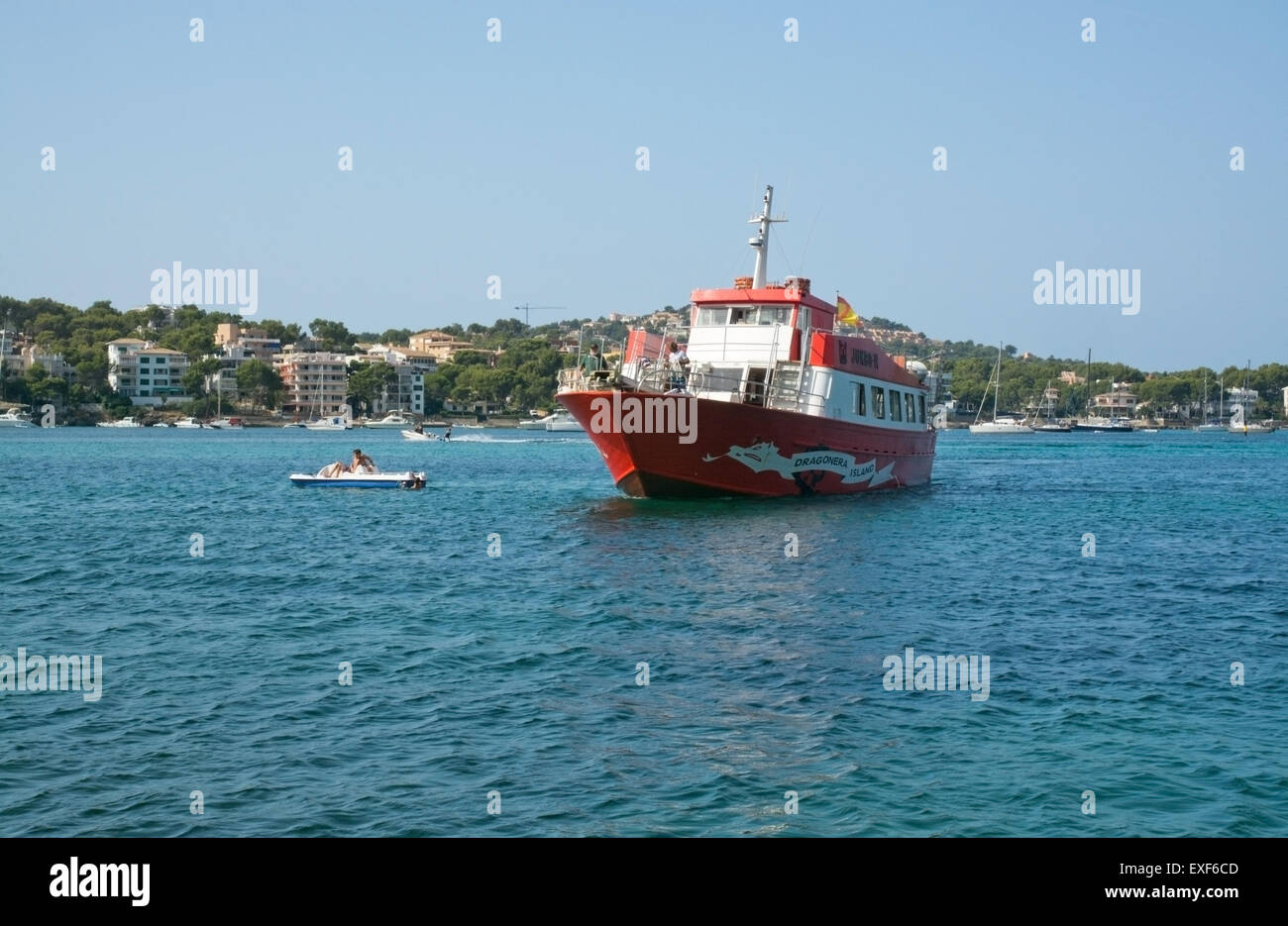 Red ferry Jumbo II touring the Dragonera Island approaching Stock Photo ...