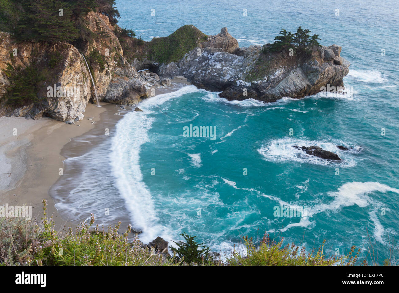Waterfall in Julia Pfeifer Burns State Park at sunset with a soft ...