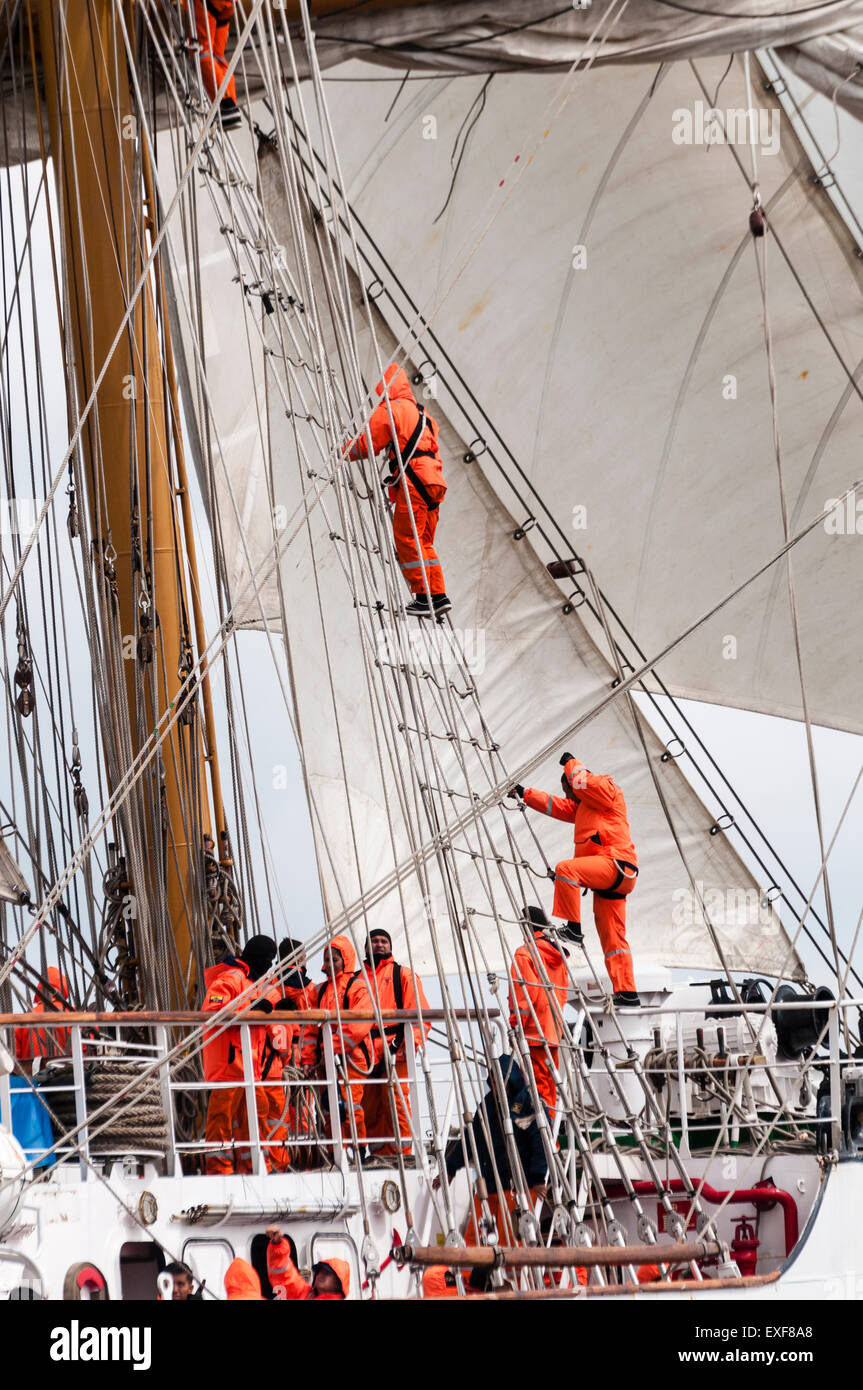 Sailors on board the Ecuadorian tall ship Guayas climb rigging to ...