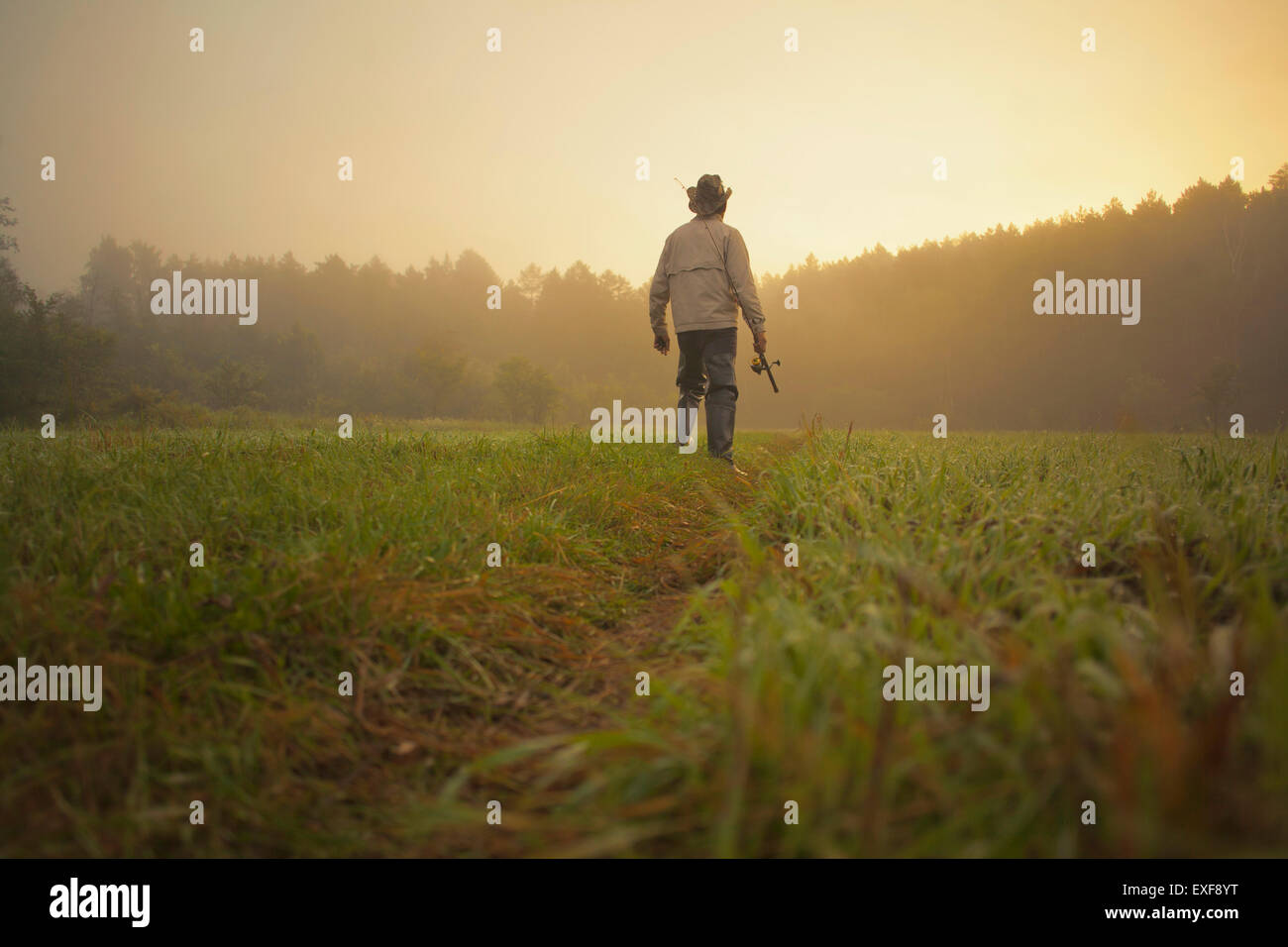 Man fisher walking rod hi-res stock photography and images - Alamy