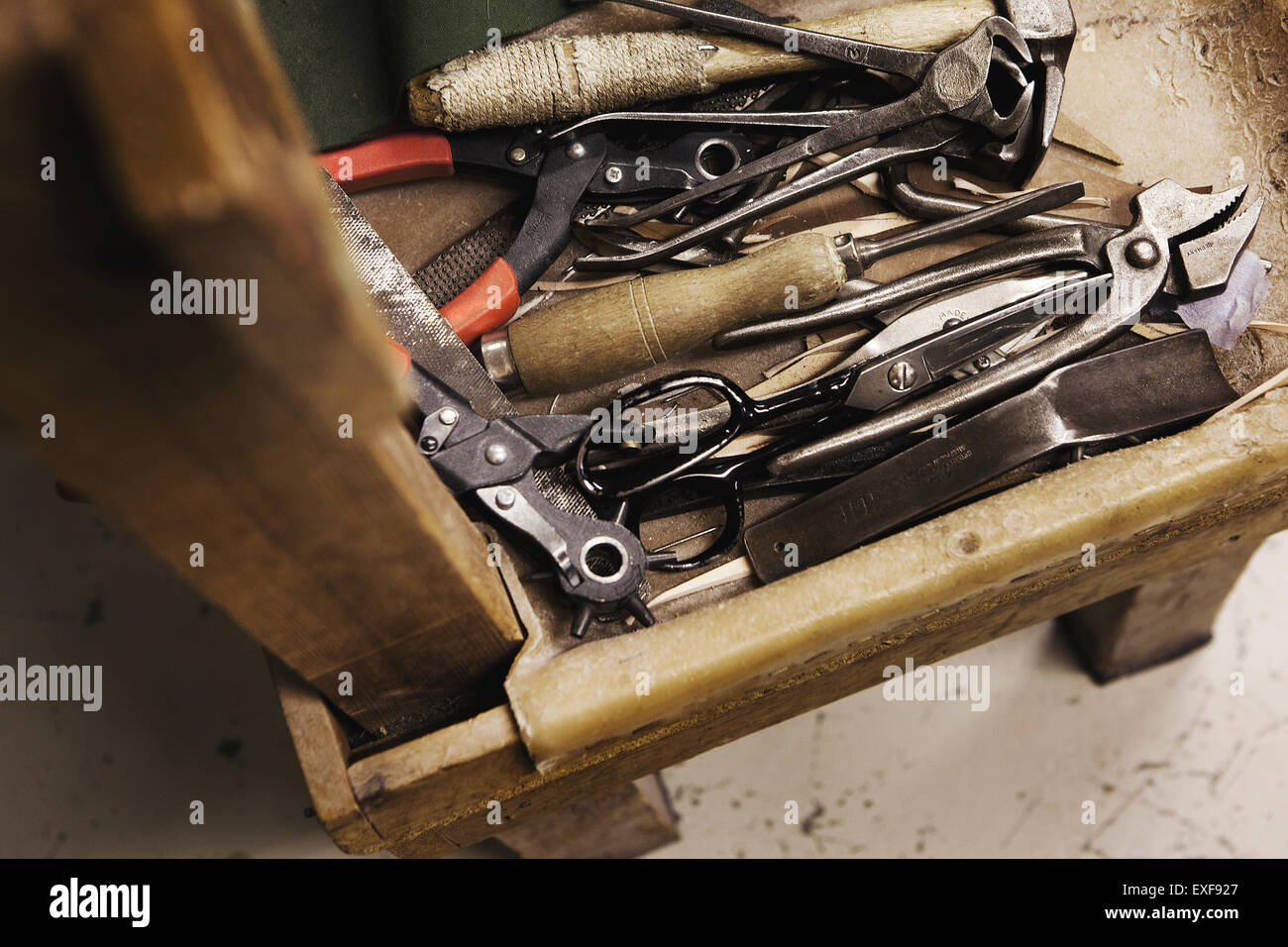 Close up of tool box and hand tools in shoe makers workshop Stock Photo ...