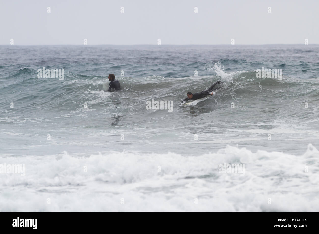 Pfeiffer Beach, California - May 01 : Male surfer in a full suit ...