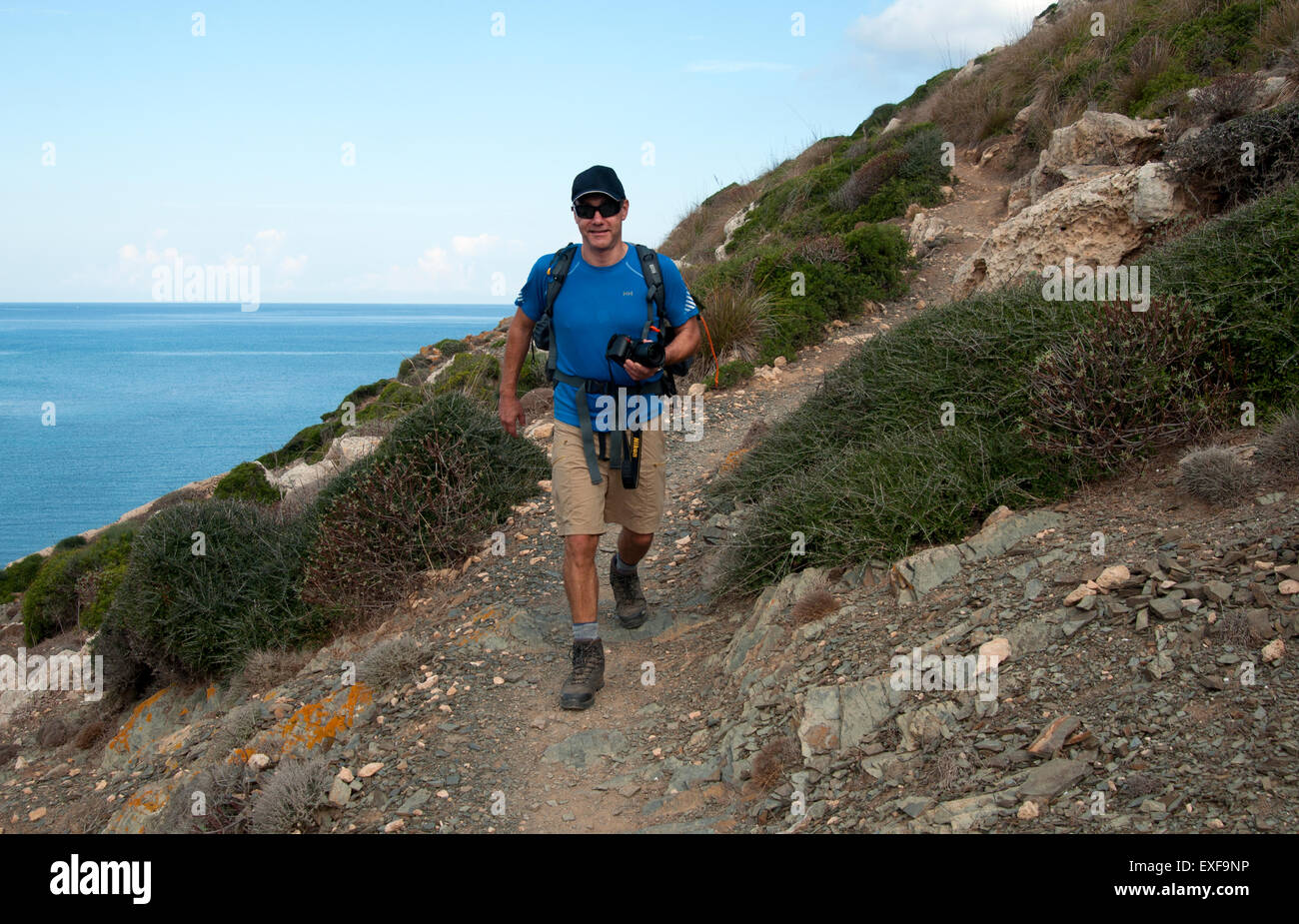 A rambler walking along the Cami de Cavalls coastal bridal path on the ...