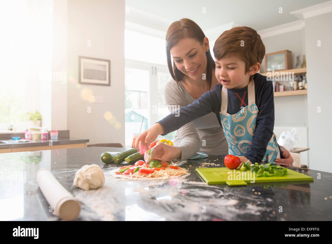 Mother son cooking pizza hi-res stock photography and images - Alamy