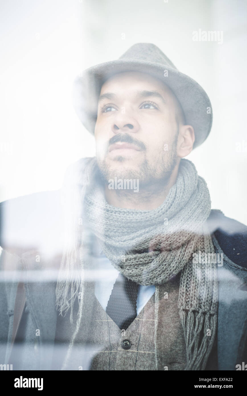 Portrait of businessman behind window Stock Photo - Alamy