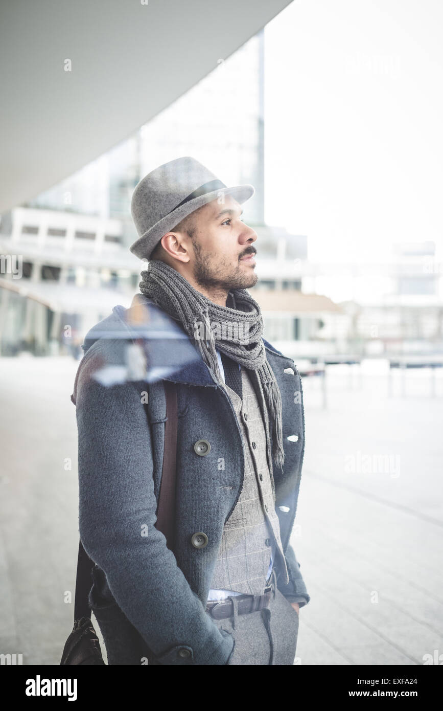 Portrait of businessman gazing behind window Stock Photo - Alamy
