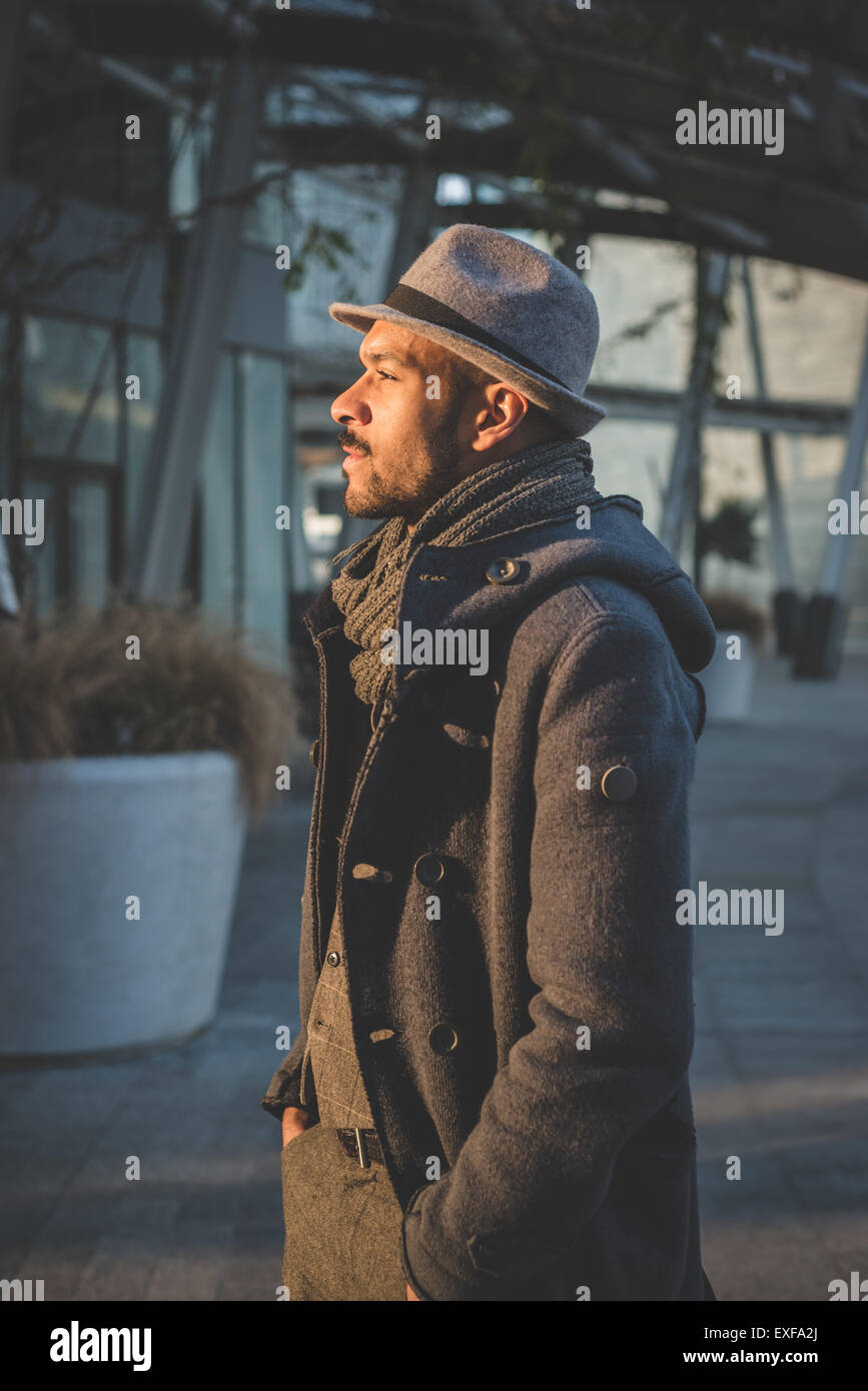 Businessman standing waiting outside office building Stock Photo - Alamy