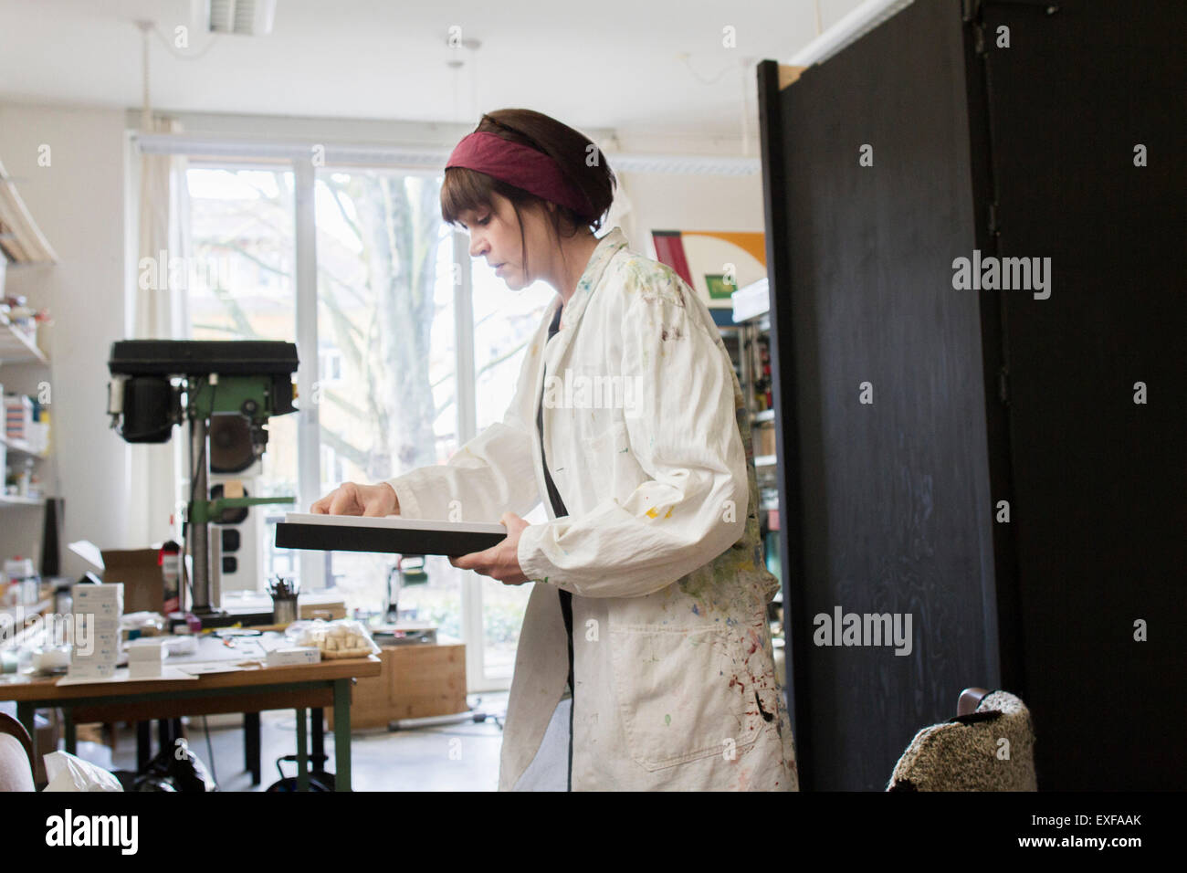 Artist working in studio Stock Photo - Alamy