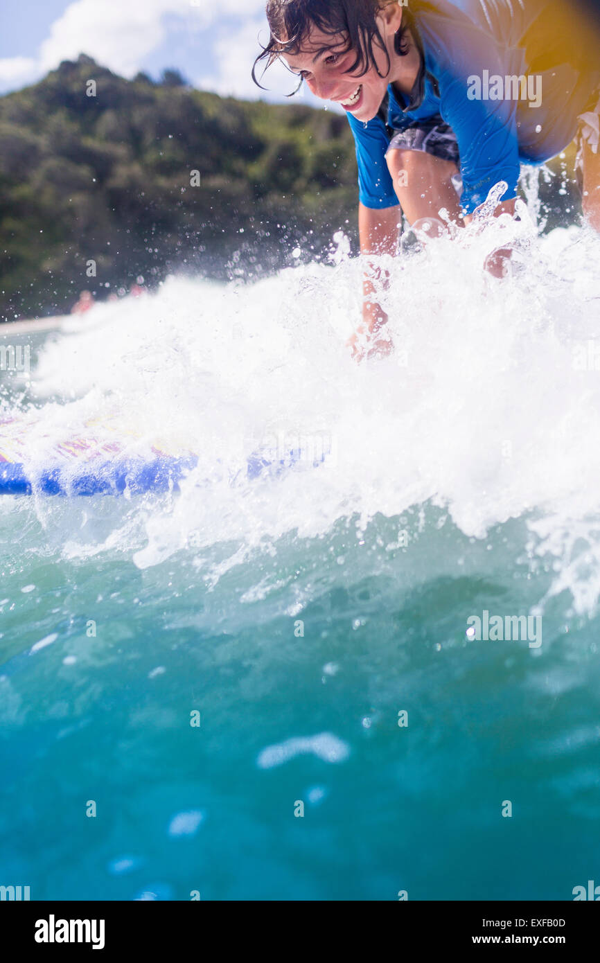 Boy surfer riding the wave Stock Photo - Alamy