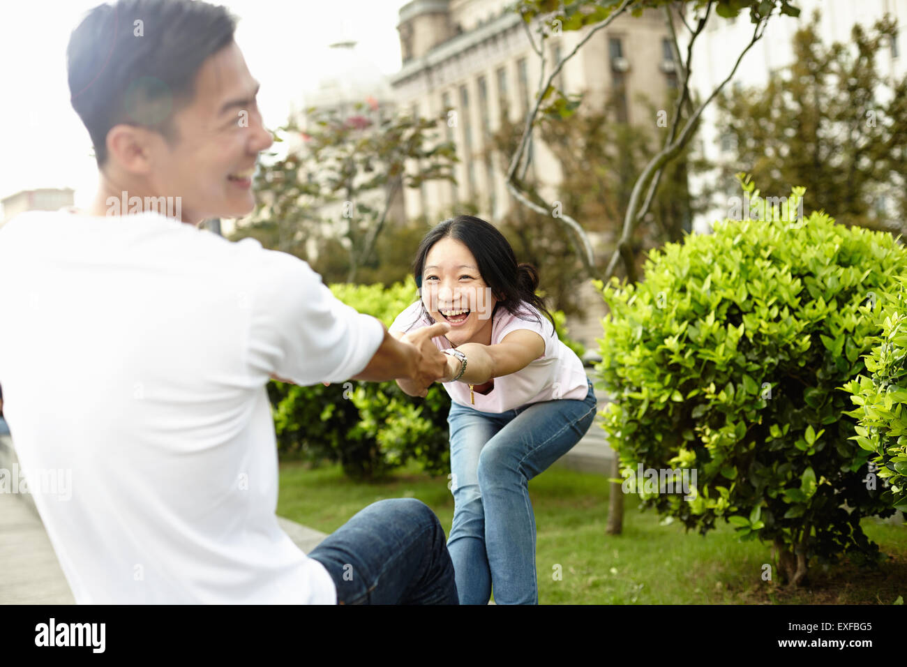 Laughing couple dancing outdoors hi-res stock photography and images ...