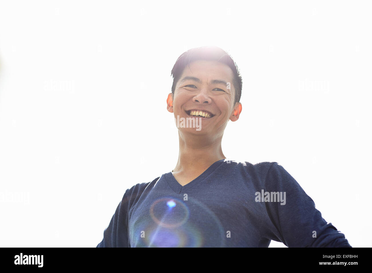 Low angle portrait of smiling mid adult man Stock Photo - Alamy