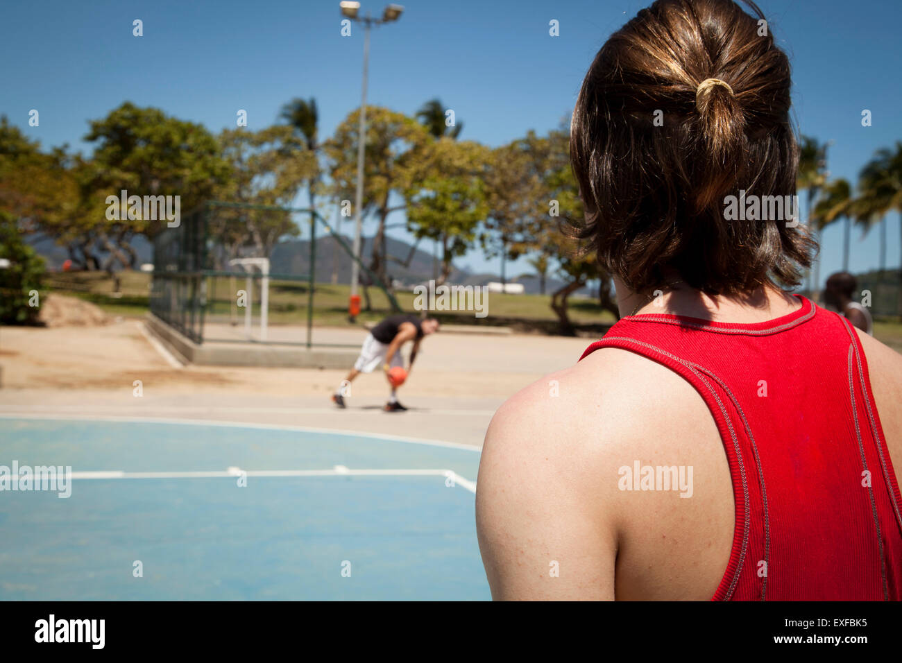Two young men playing basketball on basketball court Stock Photo - Alamy