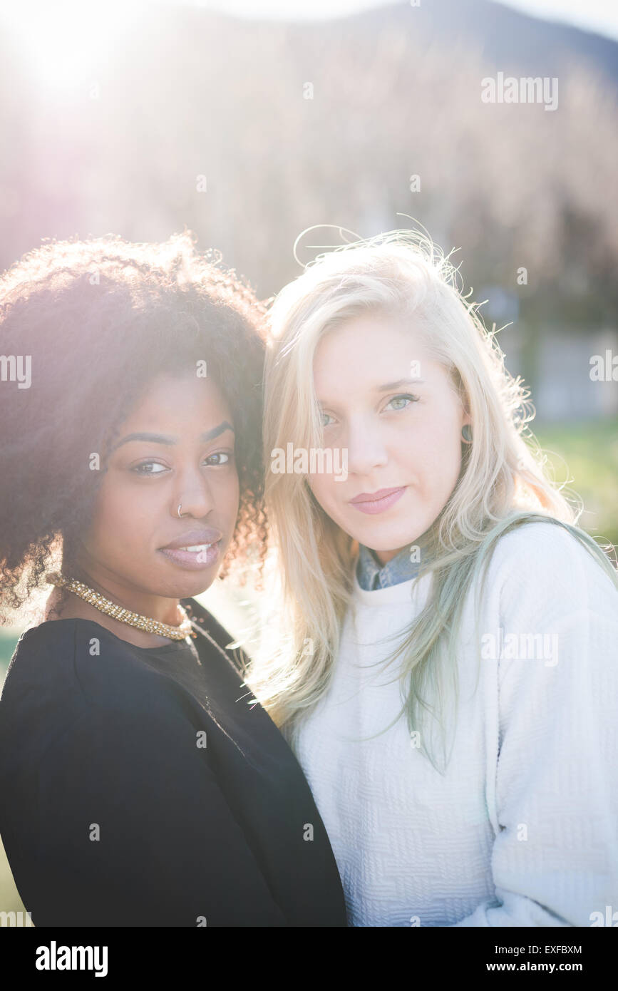 Two young women in park hi-res stock photography and images - Alamy