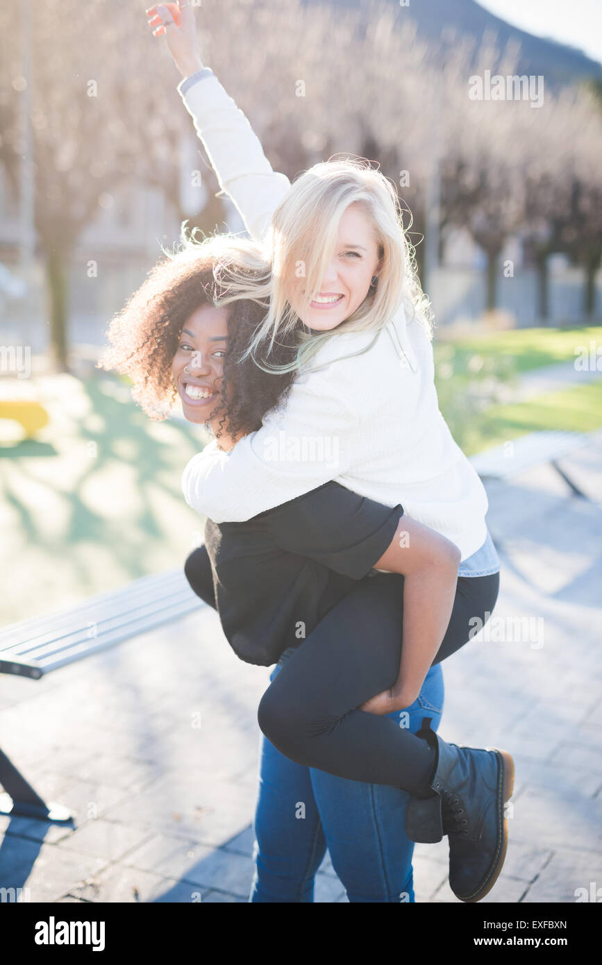 Friends piggyback race hi-res stock photography and images - Alamy