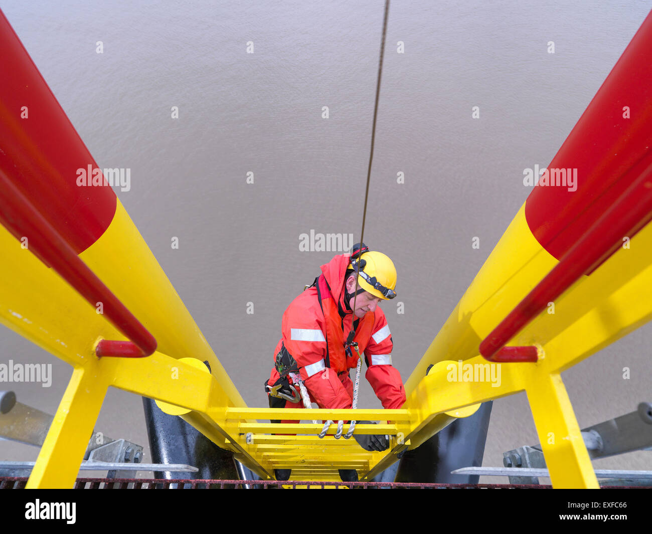 Man climbing wind turbine man wind farm hi-res stock photography and ...