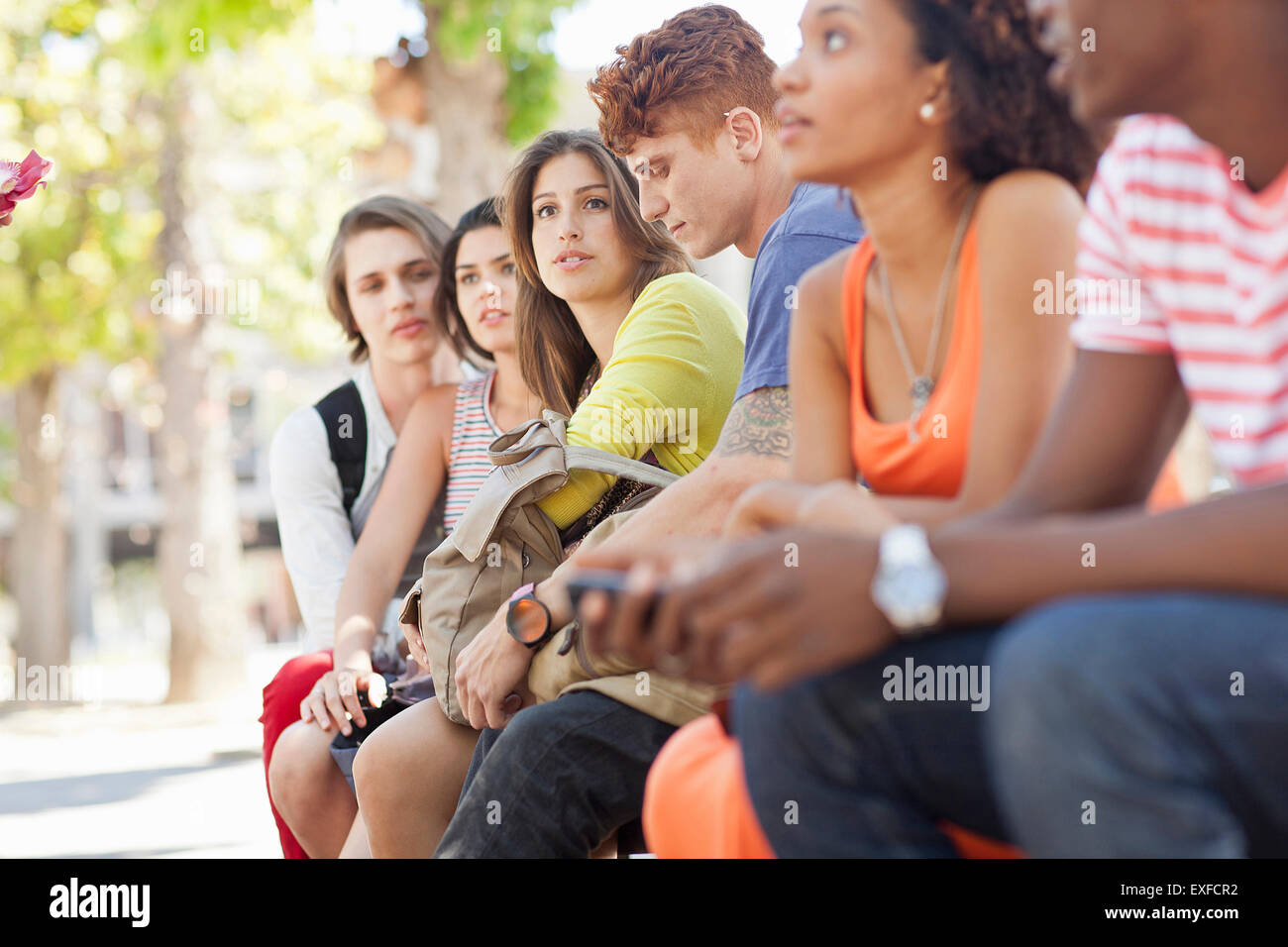 Group of people sitting under tree hi-res stock photography and images ...