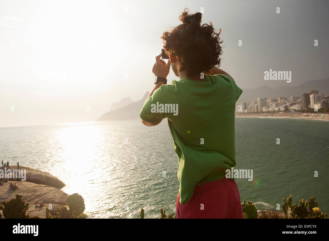 Man taking photo of view, Ipanema Beach, Rio de Janeiro, Brazil Stock ...