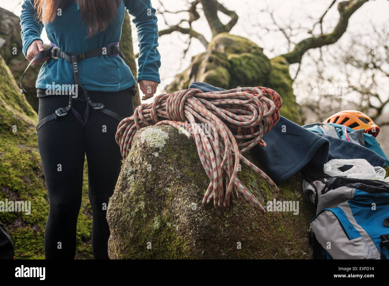 Woman putting climbing harness hi-res stock photography and images - Alamy