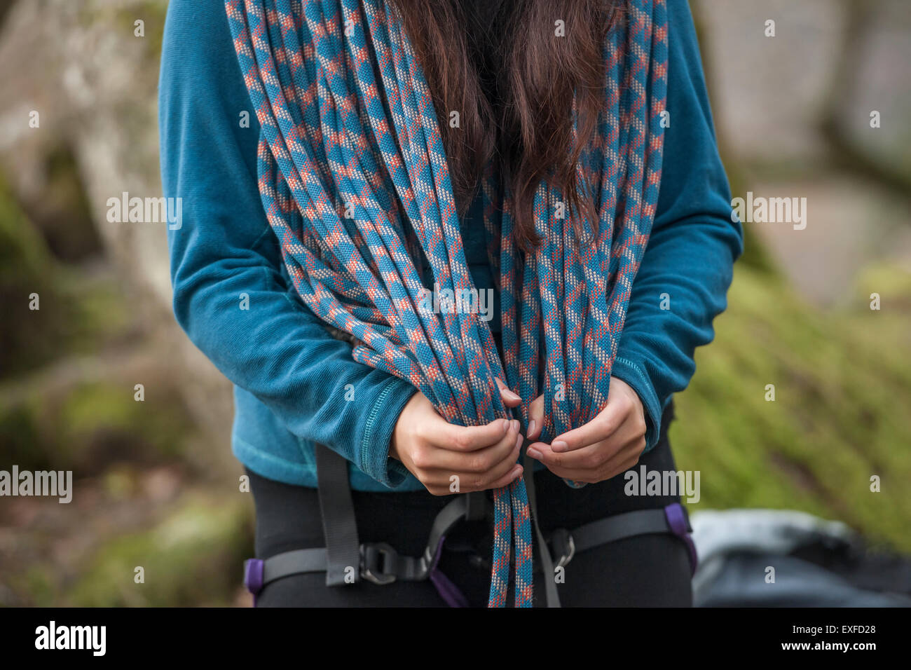 Woman with climbing rope around neck Stock Photo - Alamy