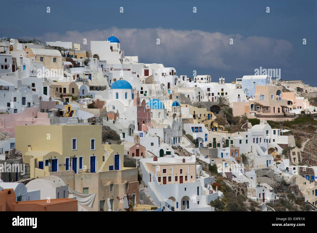 View of painted and white washed hillside town, Oia, Santorini ...