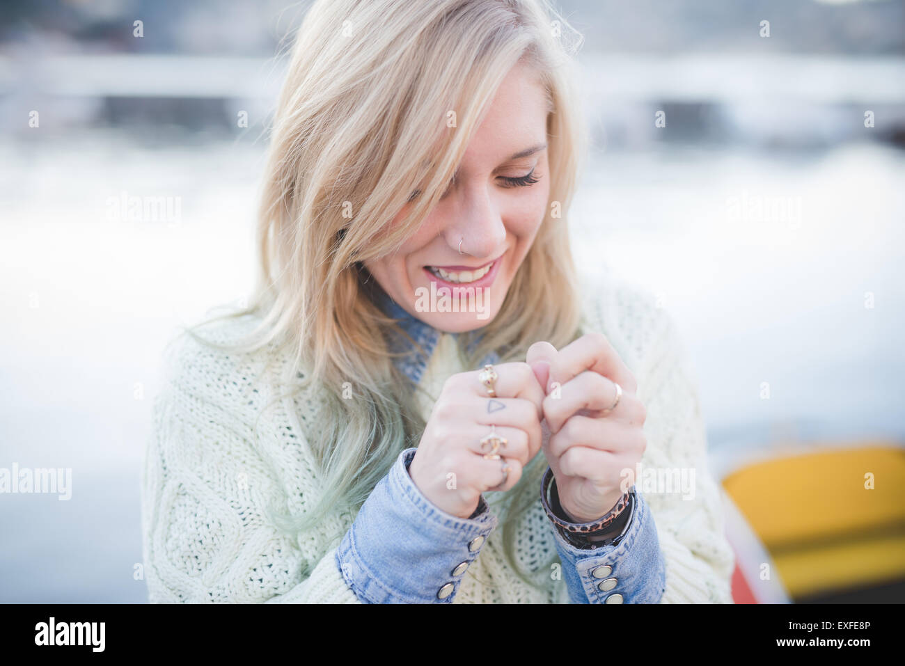 Fiddling hair woman hi-res stock photography and images - Alamy