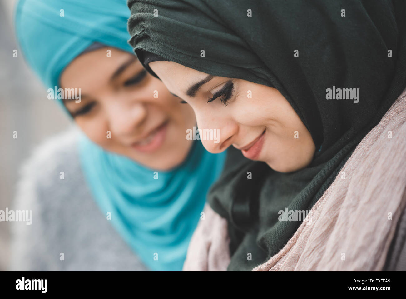 Close up of two young women wearing hijabs Stock Photo - Alamy