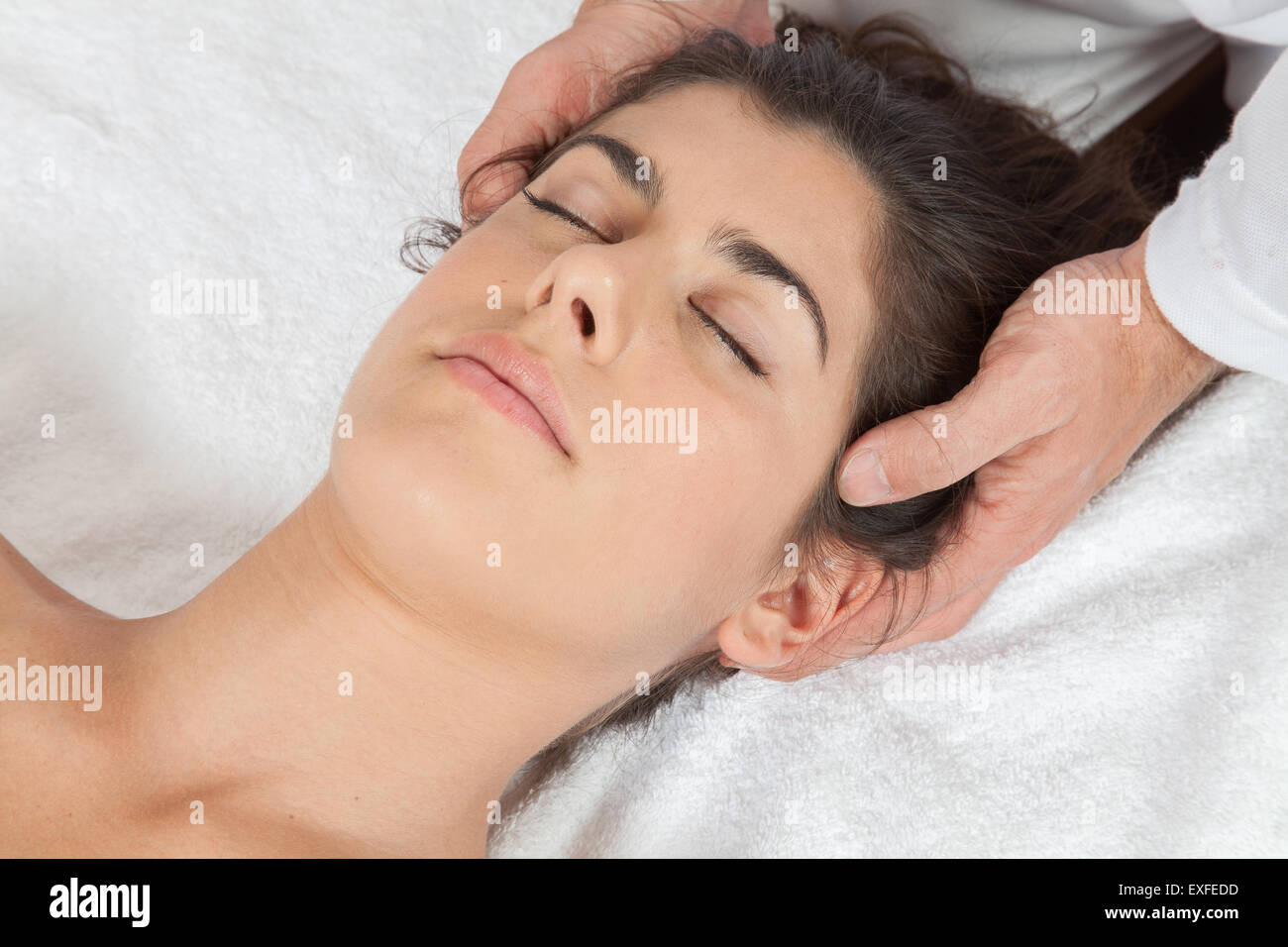 Woman getting special reiki Stock Photo - Alamy