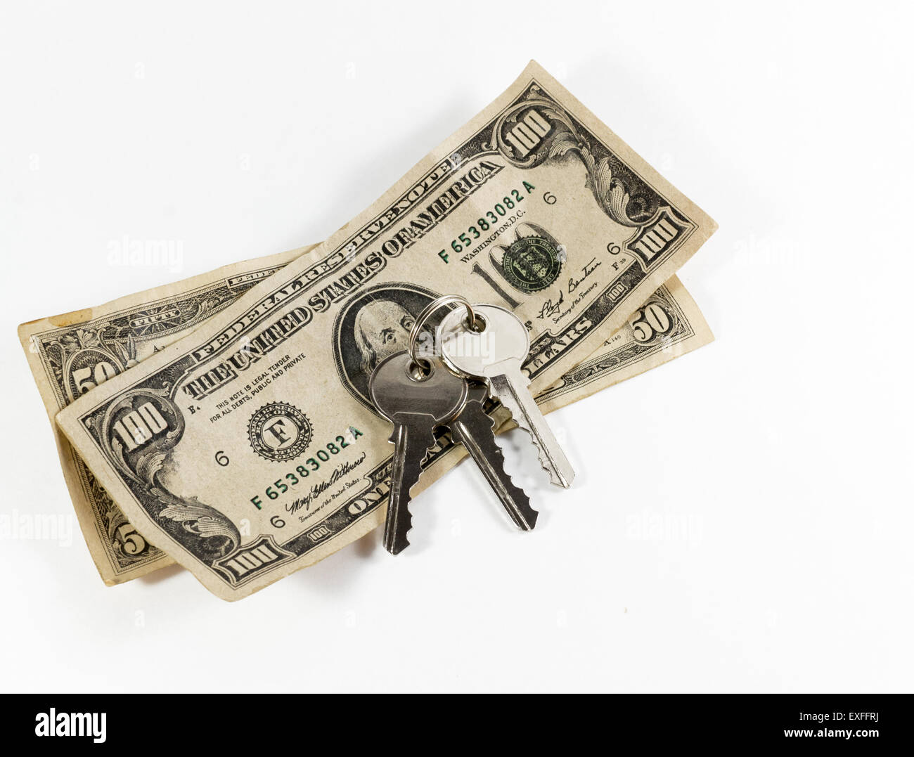 House keys with US hundred dollar bill on a white background Stock ...