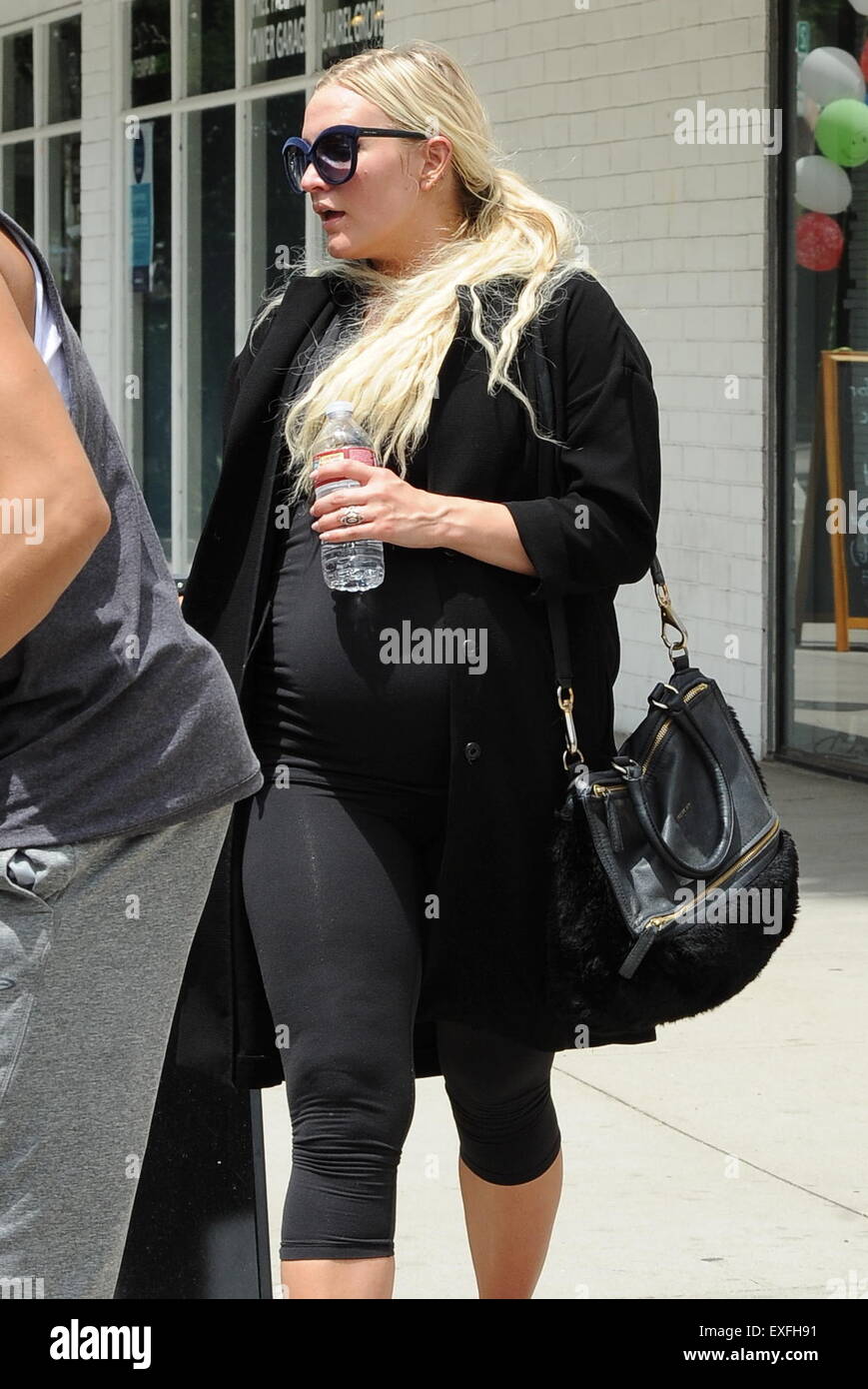 A heavily pregnant Ashlee Simpson leaves the gym in Studio City with ...