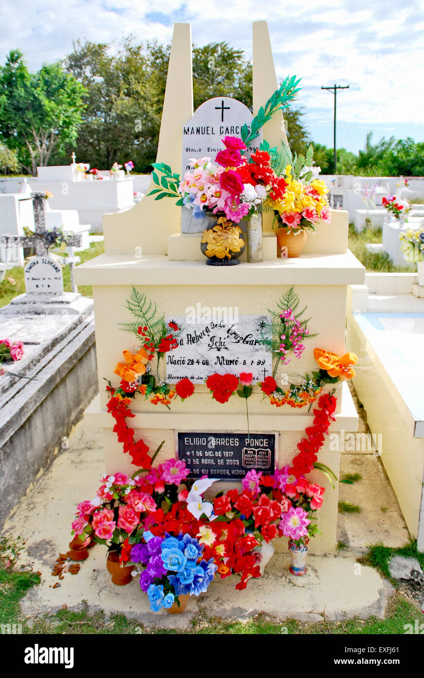 A Beautiful graveyard with white tombs and colourful flowers, in Playa ...