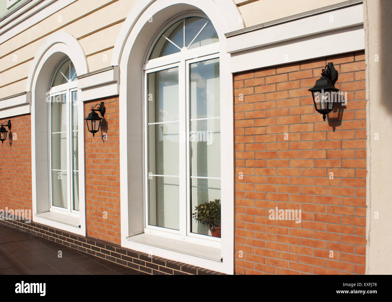two white plastic windows in a brick wall outside Stock Photo - Alamy