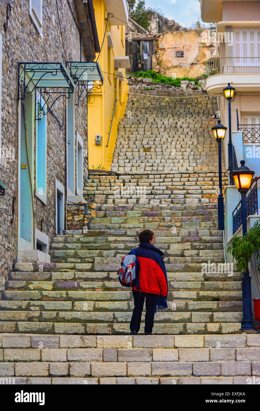 A picturesque uphill cobbled alley in the traditional medieval ...