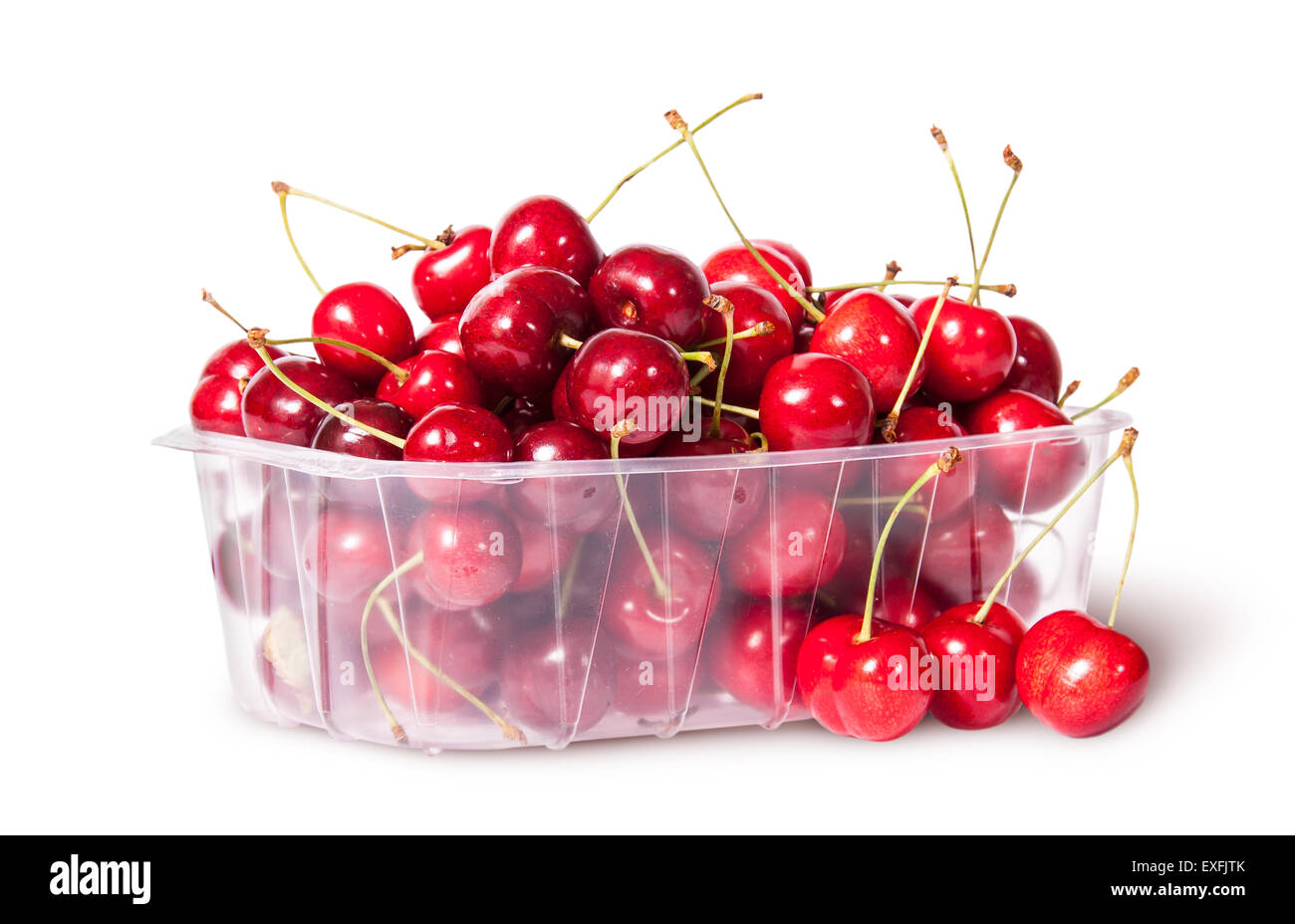 Red sweet cherries in plastic tray rotated and three near isolated on ...