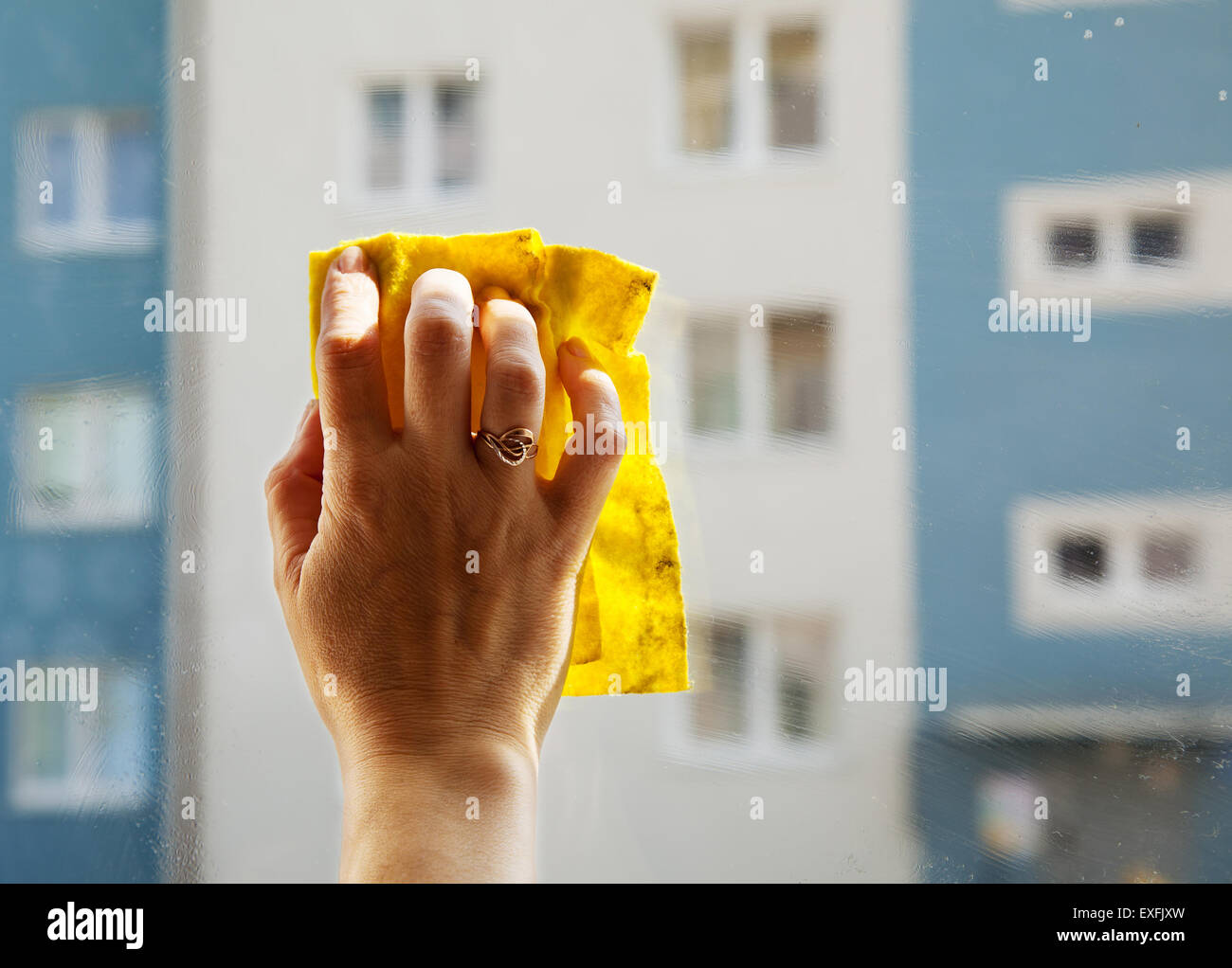 female hand washing a window pane outside closeup Stock Photo - Alamy