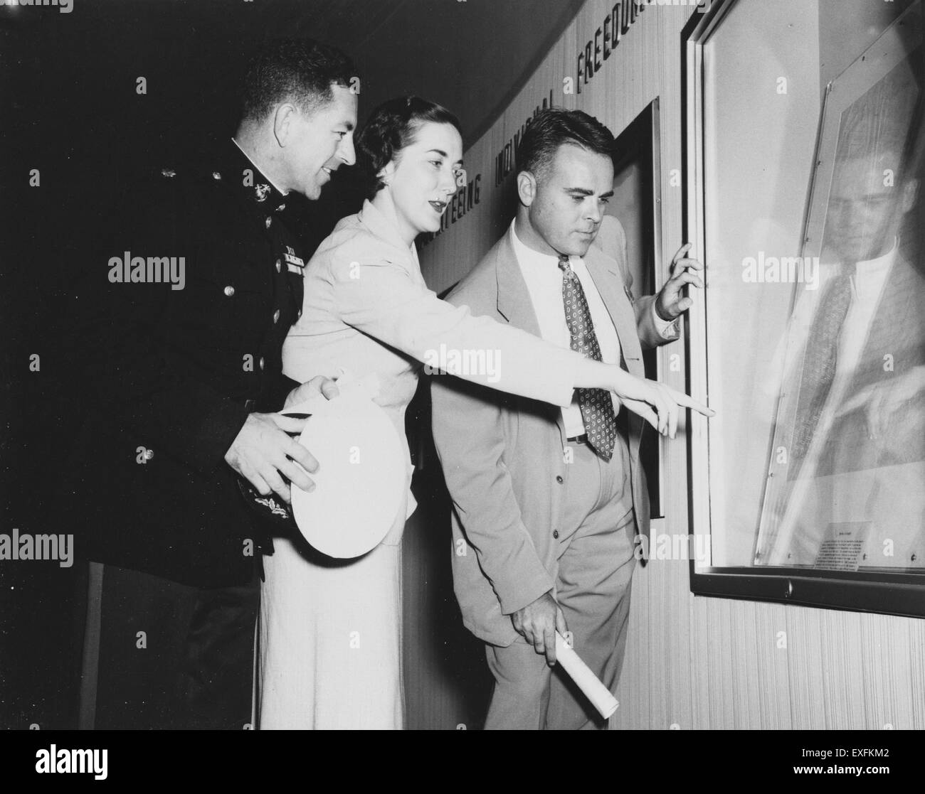 Photograph of Lt Col Scott, USMC, Elizabeth Bukowsky, and John Stock ...