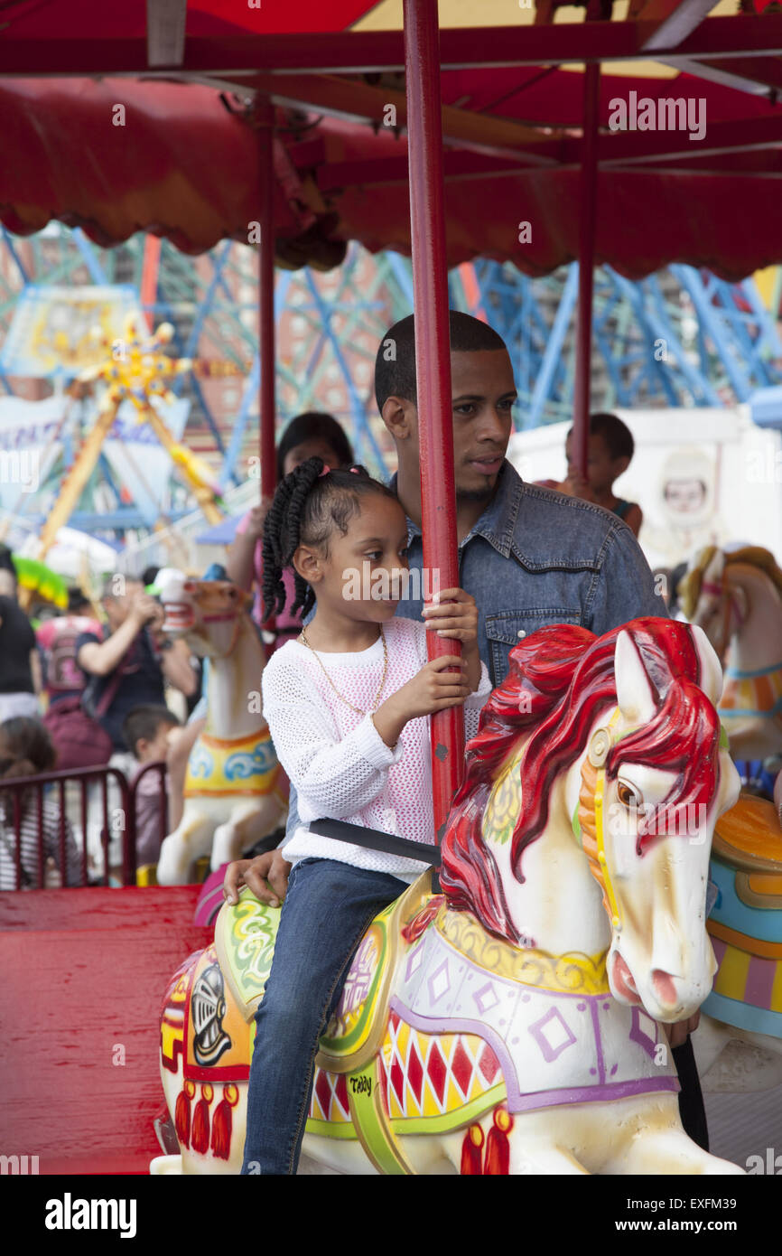 Girl riding on merry go round hi-res stock photography and images - Alamy